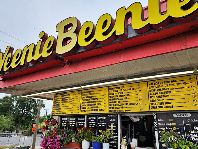 A menu board that reads like poetry to hot dog lovers. Each line offers a different path to happiness!