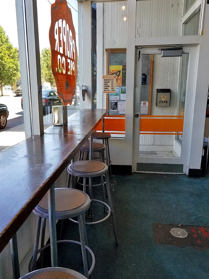 Simple metal stools line the counter where pie devotees perch, contemplating life's most important question: savory first, or straight to dessert?