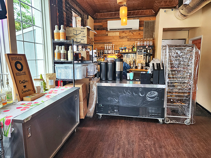Rustic wood paneling meets modern coffee equipment in this cozy space where donut dreams are born. The aroma alone is worth the visit.