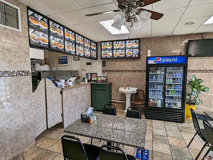 Small space, big flavors. The no-frills dining area proves that exceptional food doesn't need fancy surroundings to shine.