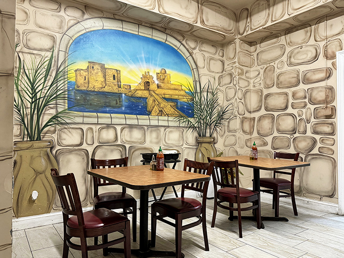 Not the Parthenon, but this stone-walled dining nook with its coastal fortress mural transports you straight to the Mediterranean without the airfare.