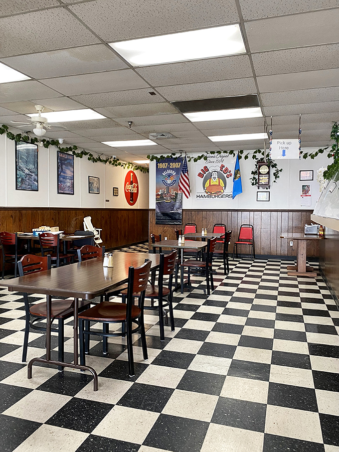 Classic black and white checkered floors set the stage for a nostalgic dining experience where comfort meets quality.