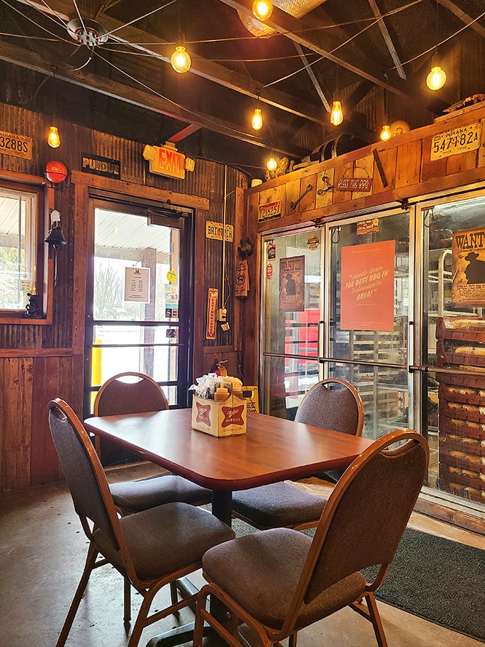 Edison bulbs cast a warm glow over rustic wood and corrugated metal walls. It's not manufactured nostalgia&mdash;it's the real deal, where every license plate tells a story.