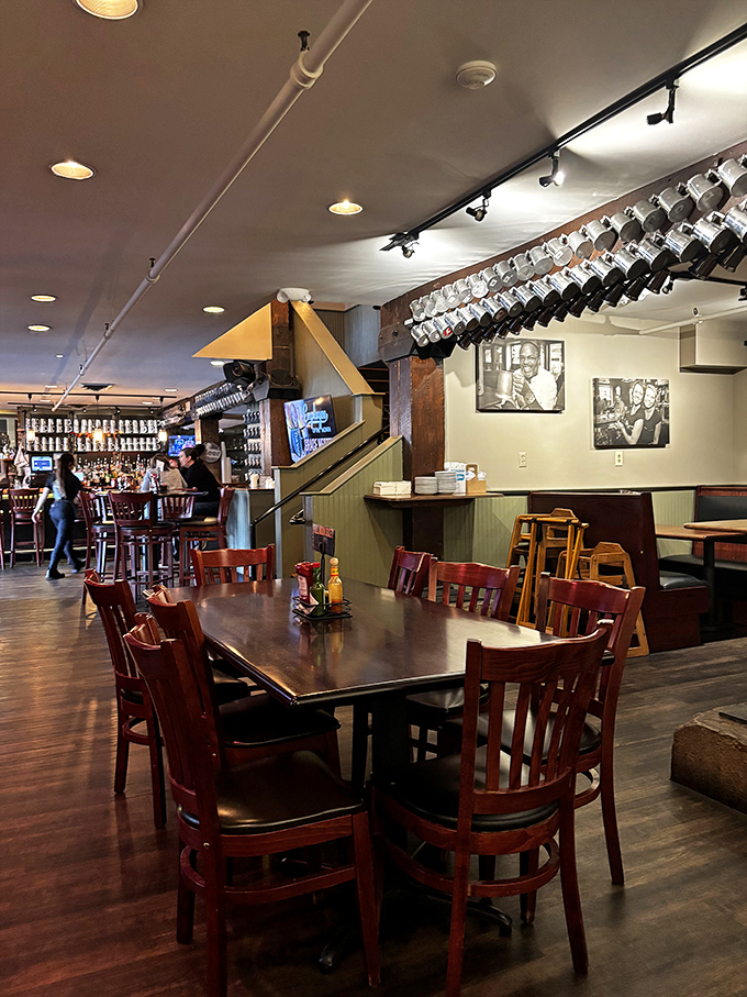 Inside, warm wood tones and hanging mugs create that perfect "third place" atmosphere&mdash;not home, not work, but somewhere you'd happily spend hours.