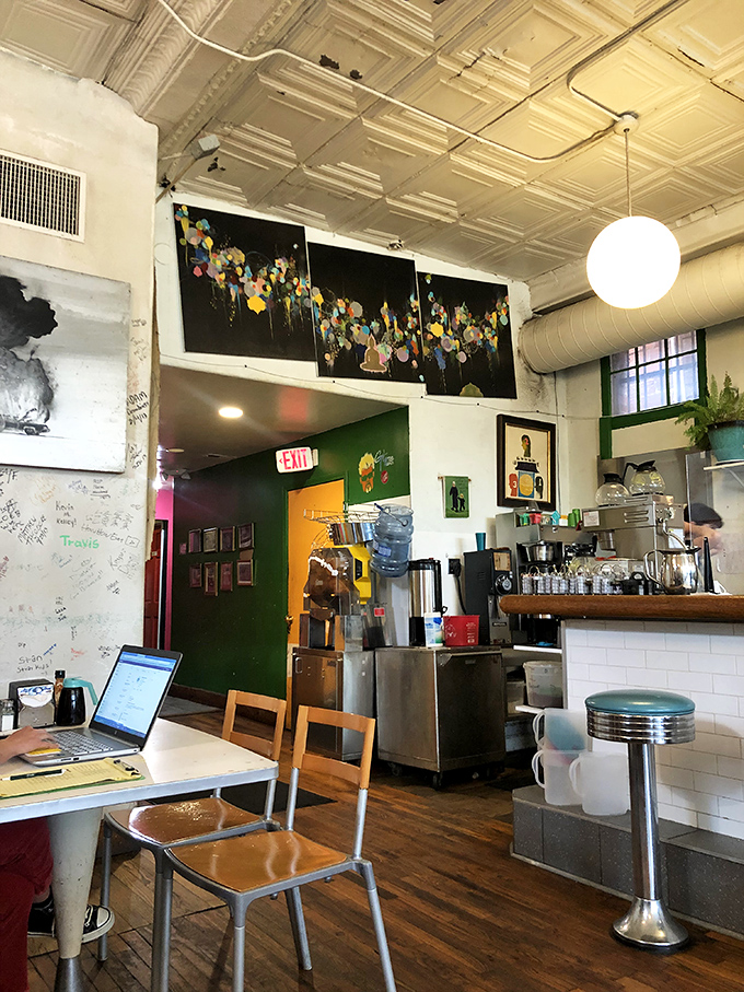 Tin ceilings, eclectic art, and mismatched furniture create that rare atmosphere where hipsters and grandparents feel equally at home.