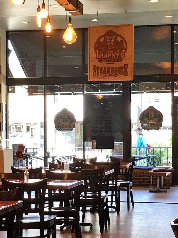 Edison bulbs cast a warm glow over wooden tables where breakfast dreams come true. The kind of place where coffee refills arrive before you realize you need one.