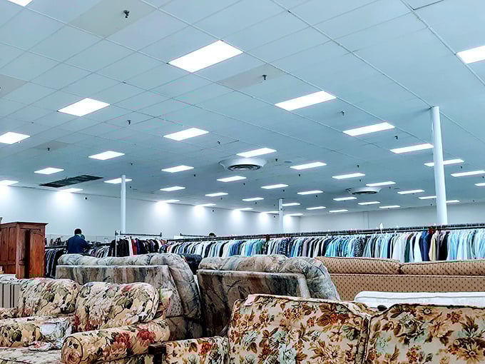 Endless racks of clothing stretch toward fluorescent horizons. It's like a department store where everything comes with a story.