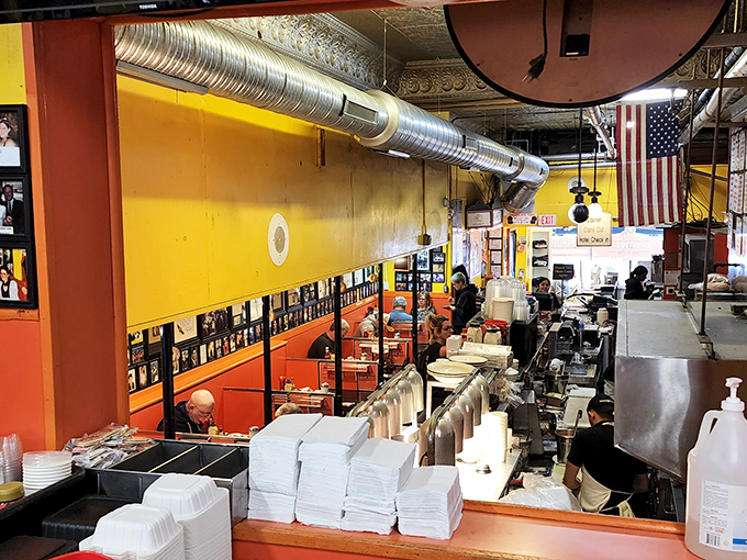 Democracy in action: politicians and plumbers sharing counter space while the American flag stands watch over mountains of hash browns.