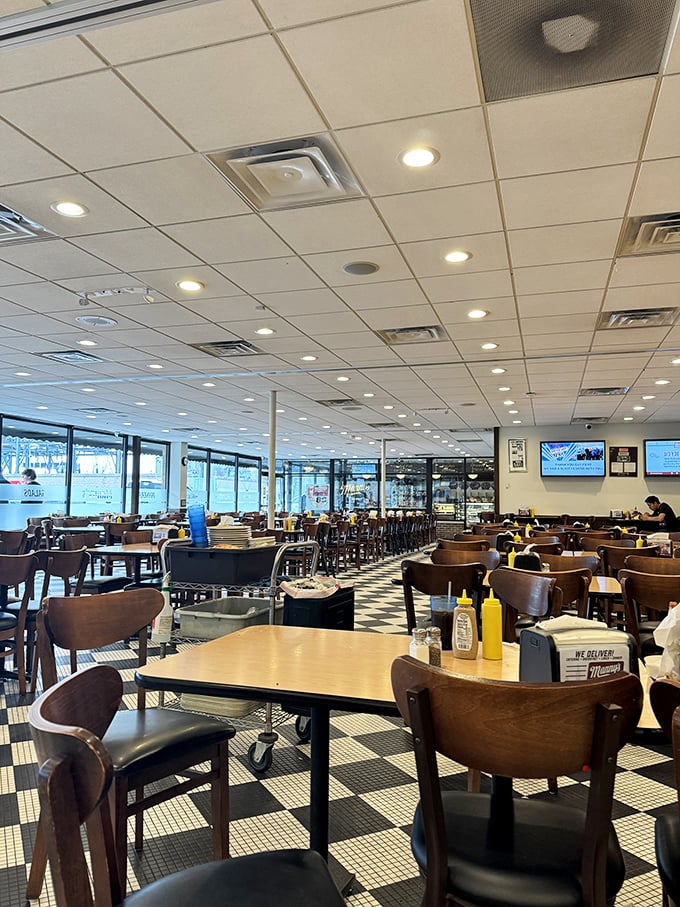 The checkered floor and no-nonsense tables tell you everything: you're here to eat, not to pose for Instagram (though you probably will anyway).