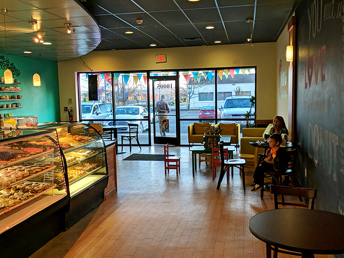 Inside, turquoise walls create a cheerful backdrop for serious donut business&mdash;where coffee conversations and sugar rushes happen daily.
