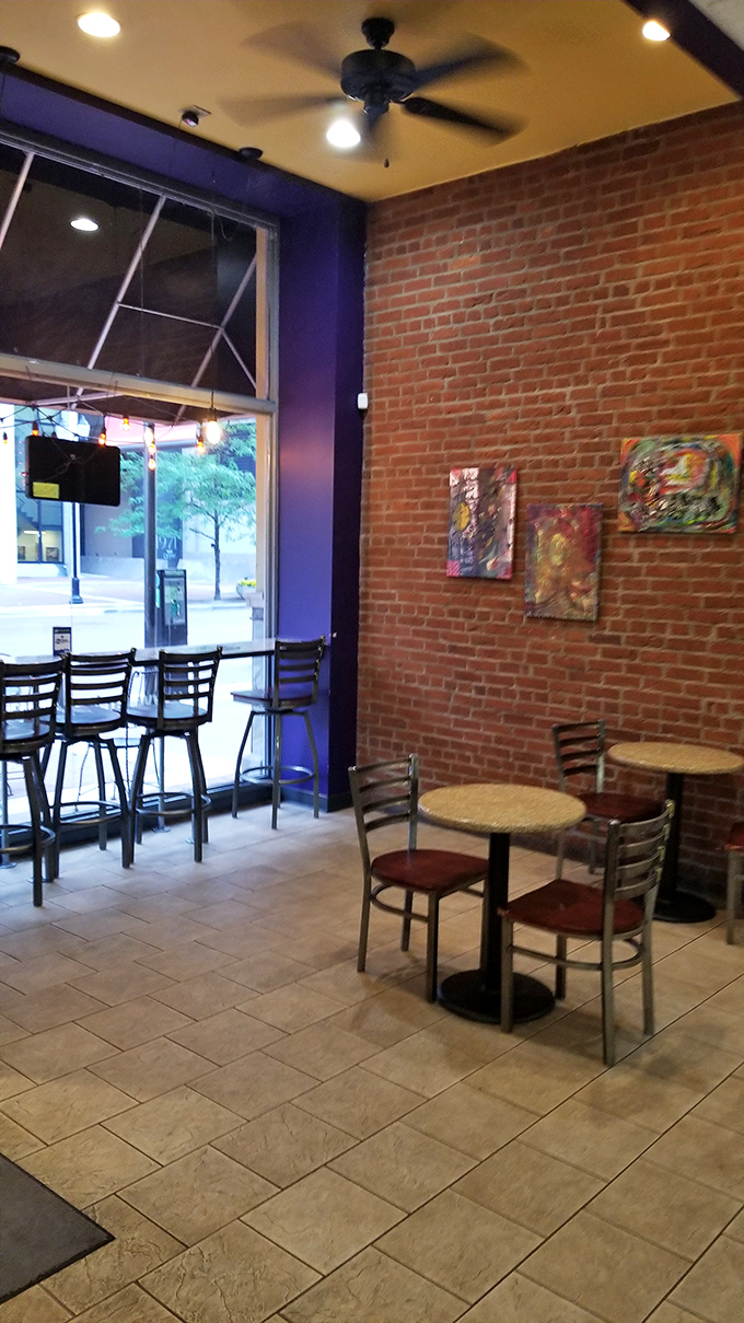 Exposed brick walls and purple accents create the perfect backdrop for donut-based epiphanies. No pretension, just a space dedicated to pastry perfection.