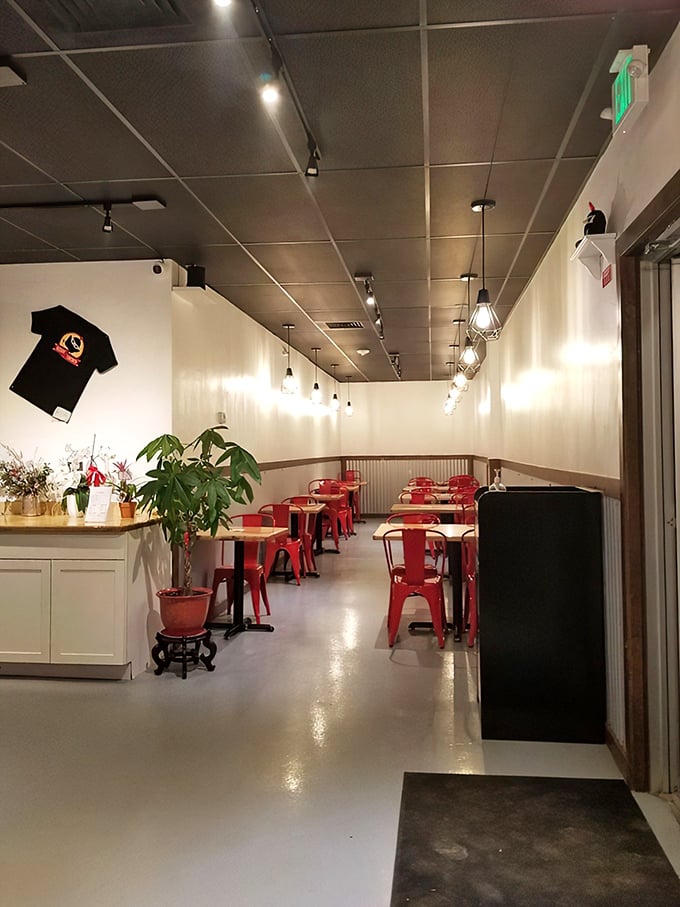 Minimalist chic meets comfort food haven. Those red metal chairs aren't just for looks &ndash; they're perfect perches for the serious business of chicken appreciation.