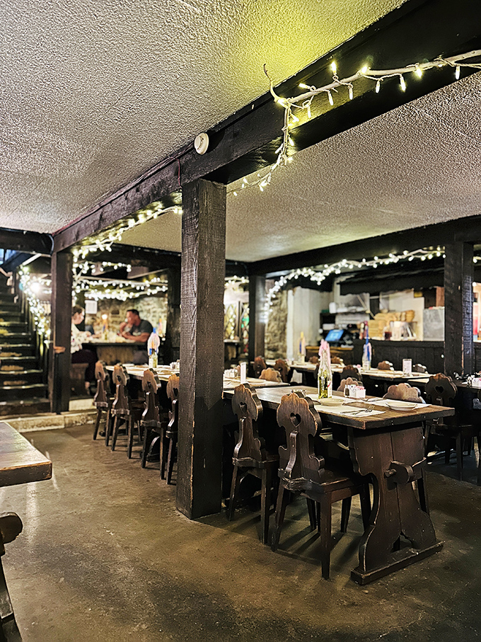 Dining under twinkling lights and centuries-old beams feels like stumbling into a European fairy tale. The wooden chairs aren't just furniture&mdash;they're time machines.