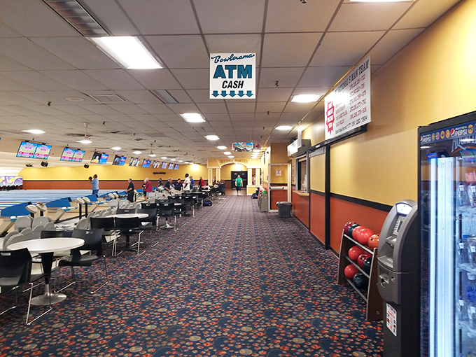The pattern on this carpet could tell a thousand stories, having survived decades of spilled sodas and the triumphant strides of perfect-game bowlers.