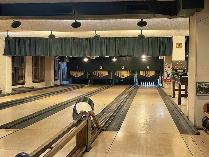 Four wooden lanes with vintage charm tell stories five decades deep. No flashing lights, just pure bowling authenticity.