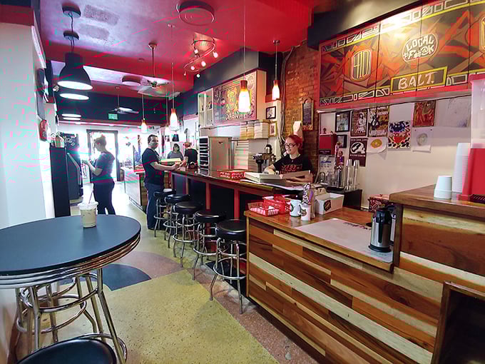 Rock 'n' roll meets pastry perfection inside this cozy red-walled haven, where wooden counters and exposed brick create the perfect backdrop for sugary rebellion.