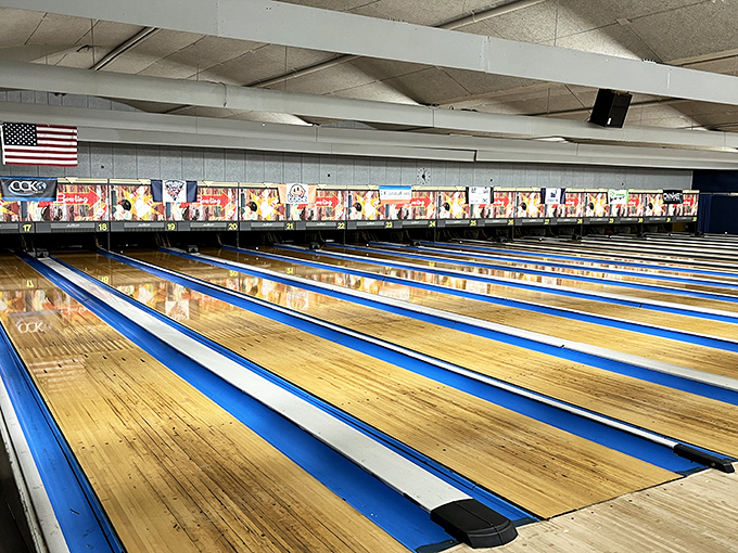 Gleaming lanes stretch toward the horizon of pins, their blue dividers and honey-colored wood creating a timeless playground for Oklahoma bowlers.