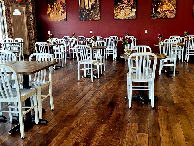 Simple white chairs and rich burgundy walls let you know&mdash;this place isn't about fancy decor. It's about what's coming to your table.