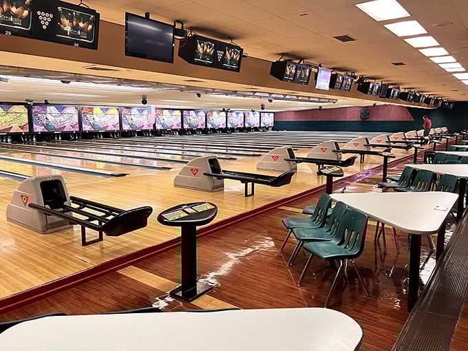 Polished lanes stretch into infinity, their golden glow promising endless possibilities for strikes, spares, and the occasional gutter ball celebration.