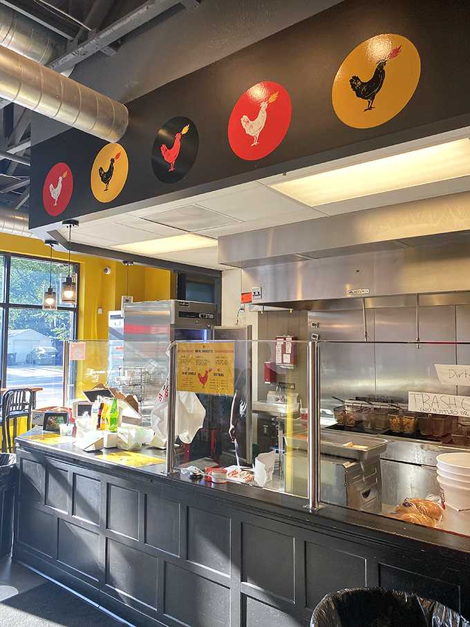 Industrial-chic meets chicken-centric design. Those colorful rooster medallions aren't just decoration&mdash;they're a warning system for what's about to happen to your taste buds.