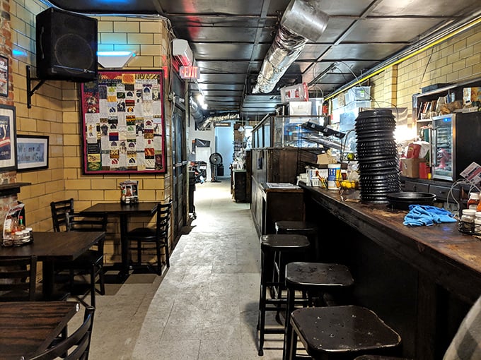 Step inside this narrow time capsule where yellow-tiled walls tell stories no interior designer could script and every seat promises a memorable meal.