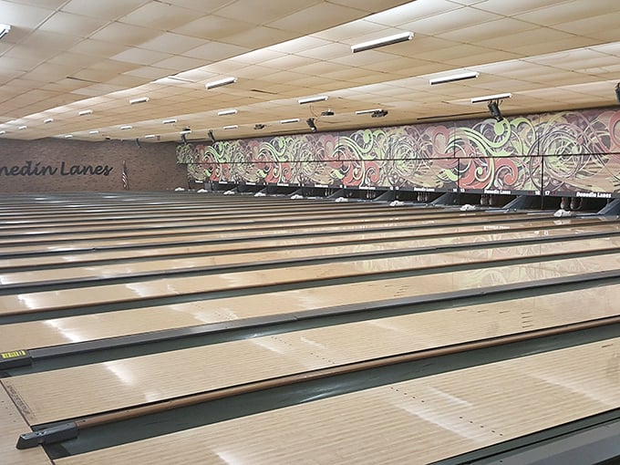 Polished lanes stretch toward infinity, where the colorful mural reminds you this isn't your grandfather's bowling alley&mdash;though he'd still love it here.