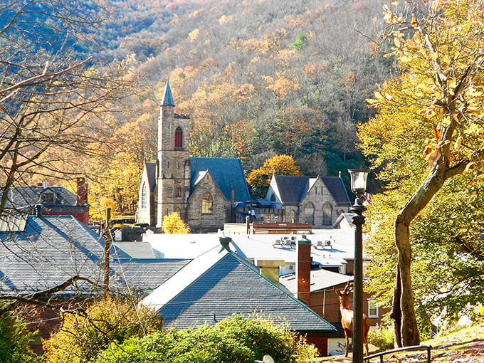 Fall foliage creates nature's perfect frame for Jim Thorpe's church steeples. The town nestles into the valley like it's getting comfortable for a long autumn nap.