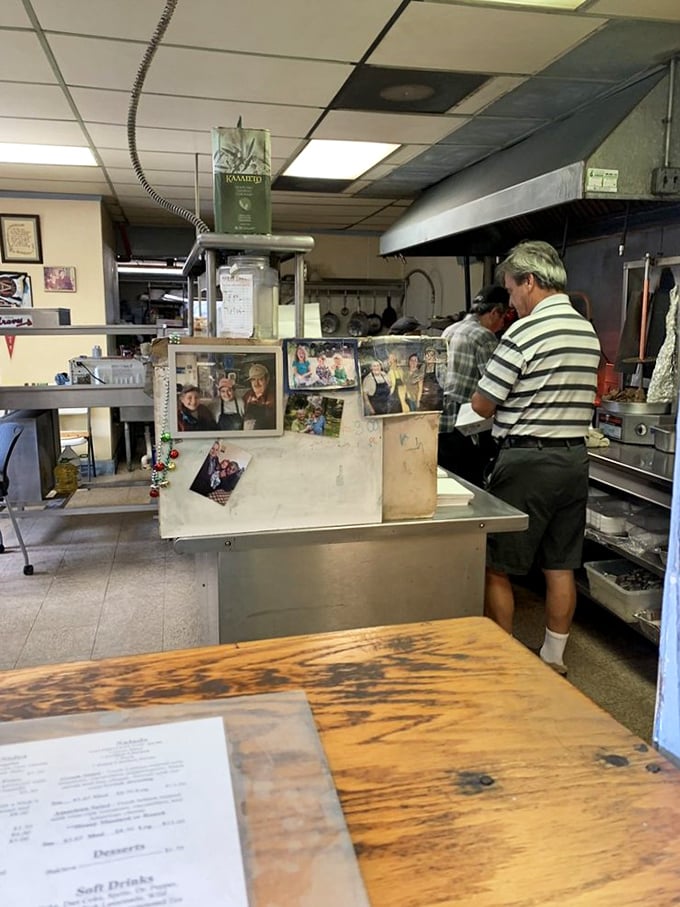 Behind this humble counter, Greek culinary magic happens daily. Family photos on display remind you this isn't just a restaurant&mdash;it's someone's passion project.