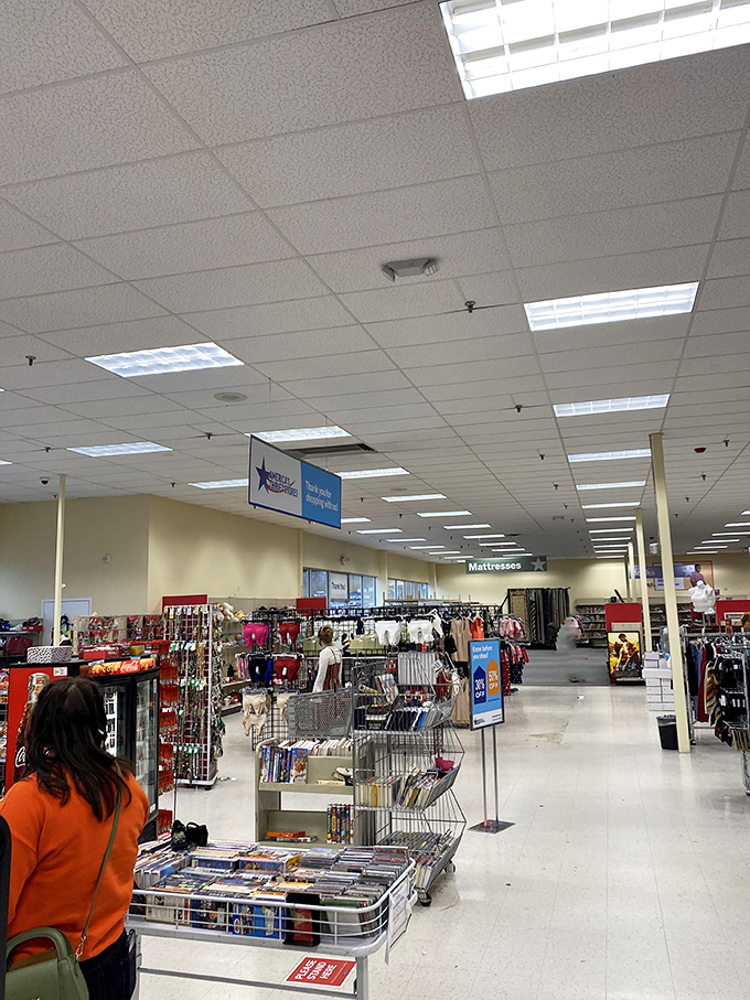 A shopper navigates the vast expanse of organized chaos. This isn't your grandmother's cramped charity shop&mdash;it's a bargain metropolis.