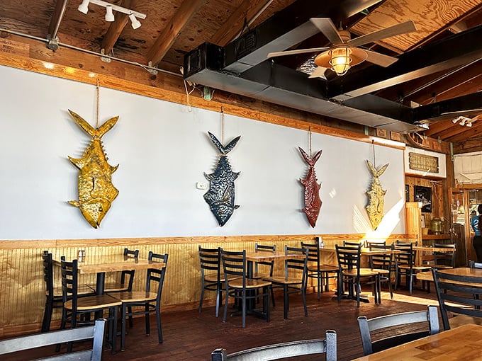Colorful fish mounts tell tales of memorable catches while wooden beams and nautical touches create the perfect backdrop for seafood feasting.