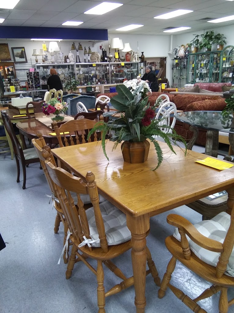 Solid oak roll-top desks and vintage writing tables line up like eager candidates at a job interview, each with stories etched into their wood grain.