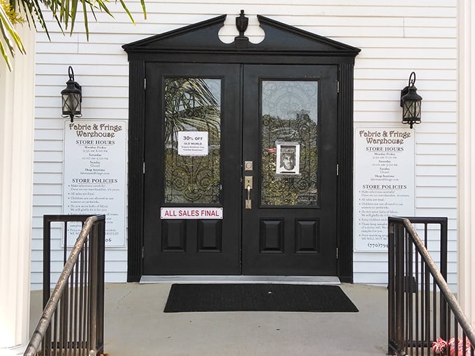 These elegant black doors might as well have a sign reading "Abandon all budget constraints, ye who enter here."