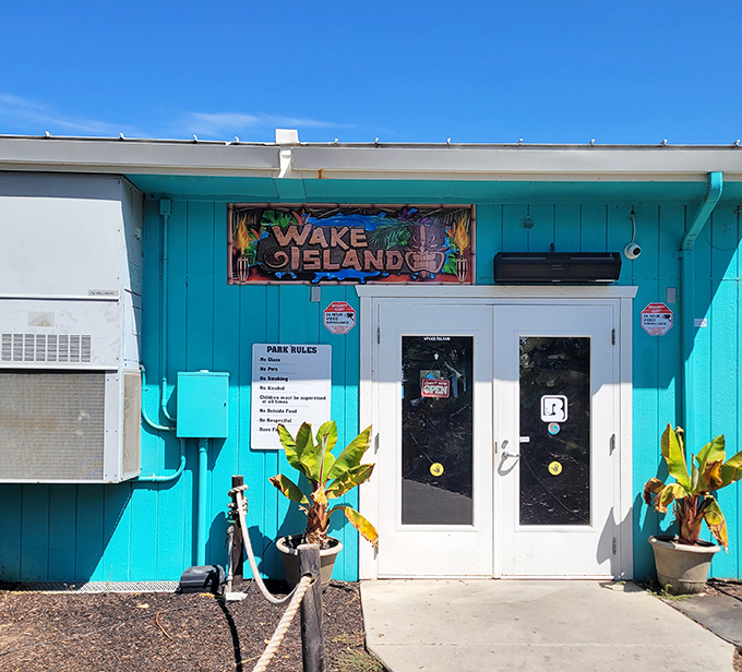 Tropical vibes abound at the turquoise entrance building, where park rules politely suggest you leave your dignity at the door and embrace the inevitable splashing.