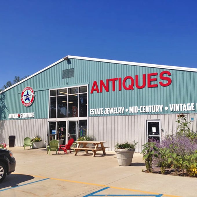 Colorful outdoor seating welcomes visitors to this treasure trove, where lavender and greenery soften the industrial exterior&mdash;your first hint that this isn't ordinary antiquing.