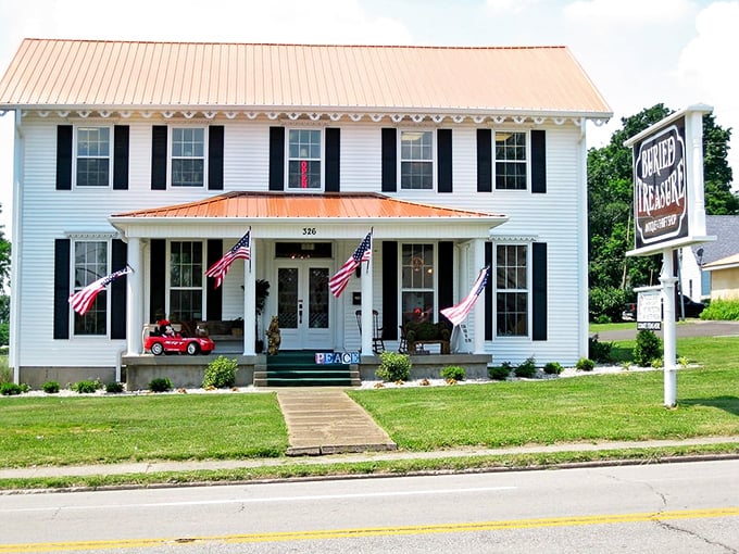Welcome to the gateway of vintage wonder! American flags flutter a patriotic greeting at this stately building housing countless memories.