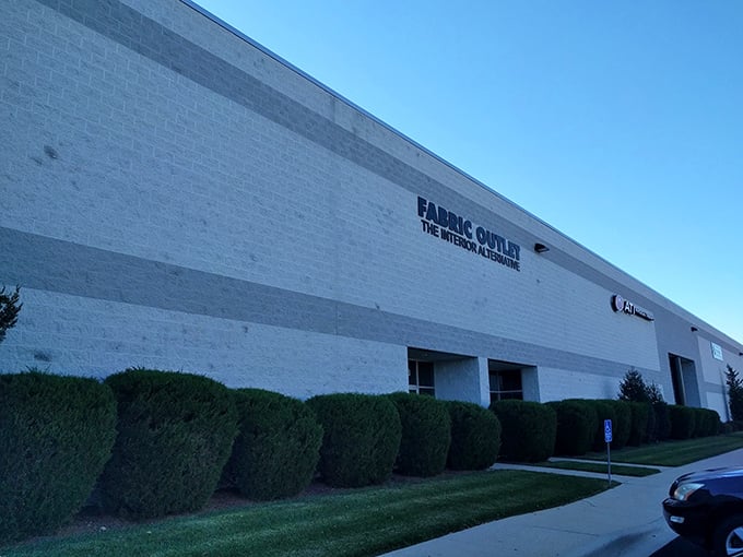 Like a fabric speakeasy, this understated building gives no hint of the kaleidoscope of colors and textures waiting inside.