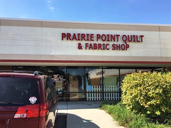 Sunshine and creativity await as Prairie Point's welcoming entrance stands ready to transform first-timers into lifetime fabric enthusiasts.