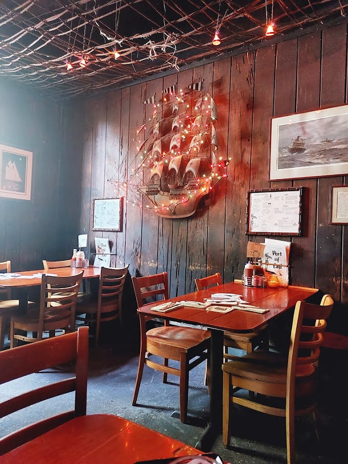 Nautical dreams meet comfort food reality in this wood-paneled dining room where ship models twinkle with tiny lights overhead.