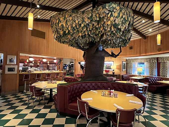 Gather 'round the money tree! OK Cafe's signature centerpiece anchors the dining room, surrounded by cozy red vinyl booths and checkerboard floors.