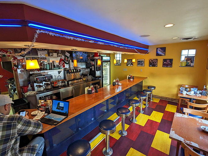 Colorful floor tiles and sunny yellow walls create the perfect backdrop for morning conversations and coffee refills.