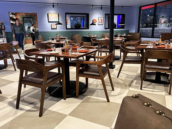 Mid-century modern meets breakfast haven in this thoughtfully designed interior where wooden chairs invite you to settle in for the long haul.