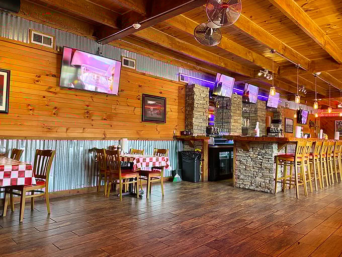 Knotty pine walls, corrugated metal accents, and checkered tablecloths&mdash;the barbecue trinity of decor. This isn't interior design; it's a promise of authenticity.