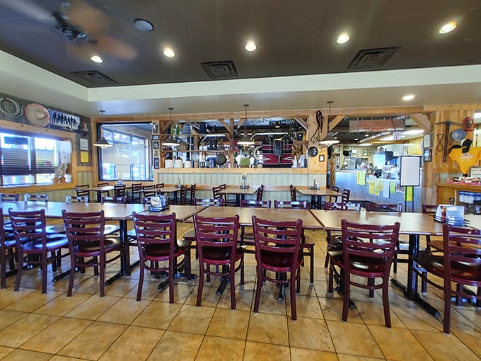 Simple wooden chairs await hungry patrons in a dining room where conversation flows as freely as the BBQ sauce. This isn't Instagram decor—it's authenticity with a side of comfort.