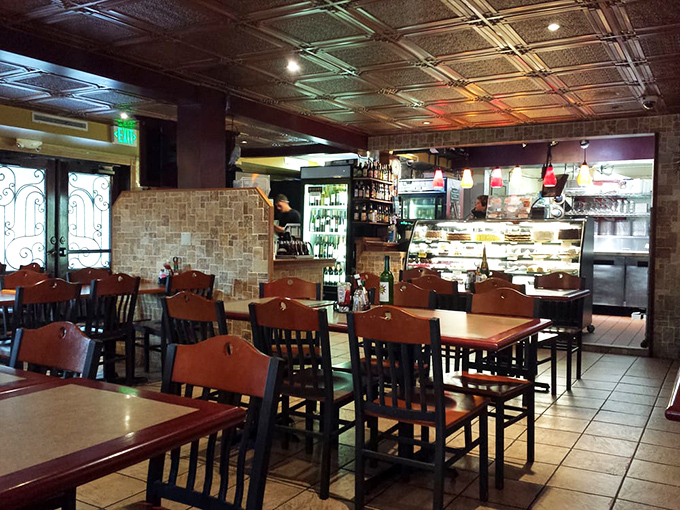 Warm wood tones, decorative tin ceilings, and just enough space to feel cozy without crowding&mdash;this is breakfast with character, not corporate calculation.