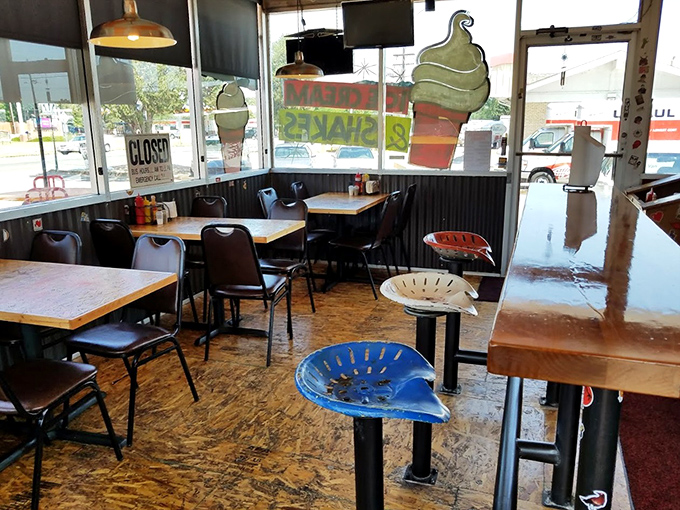 Inside, tractor-seat stools add a playful touch to the utilitarian space, where hand-painted ice cream decorations remind you to save room for dessert.