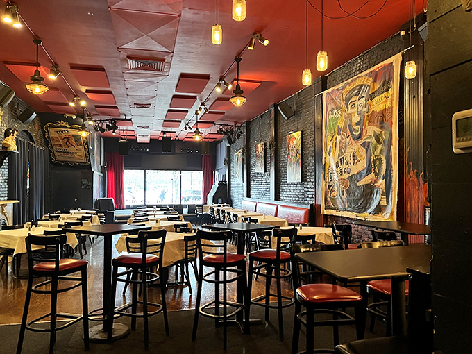 Exposed brick walls adorned with vibrant folk art create the perfect backdrop for culinary magic. It's like dining inside a blues album cover.