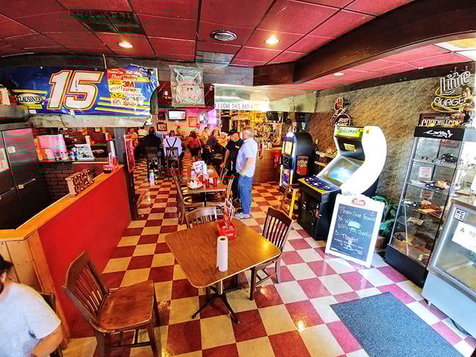 The classic red and cream checkered floor says "nostalgic diner," but those arcade games whisper "stay awhile after your food coma."
