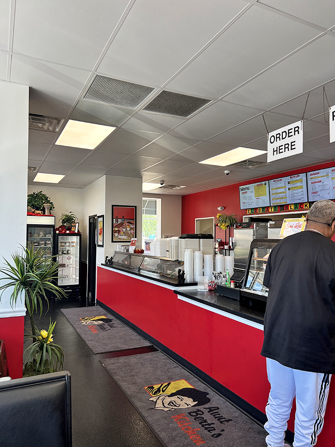 The bright red counter serves as mission control for flavor launches. This no-frills interior focuses on what matters most&mdash;getting that incredible food to your table.