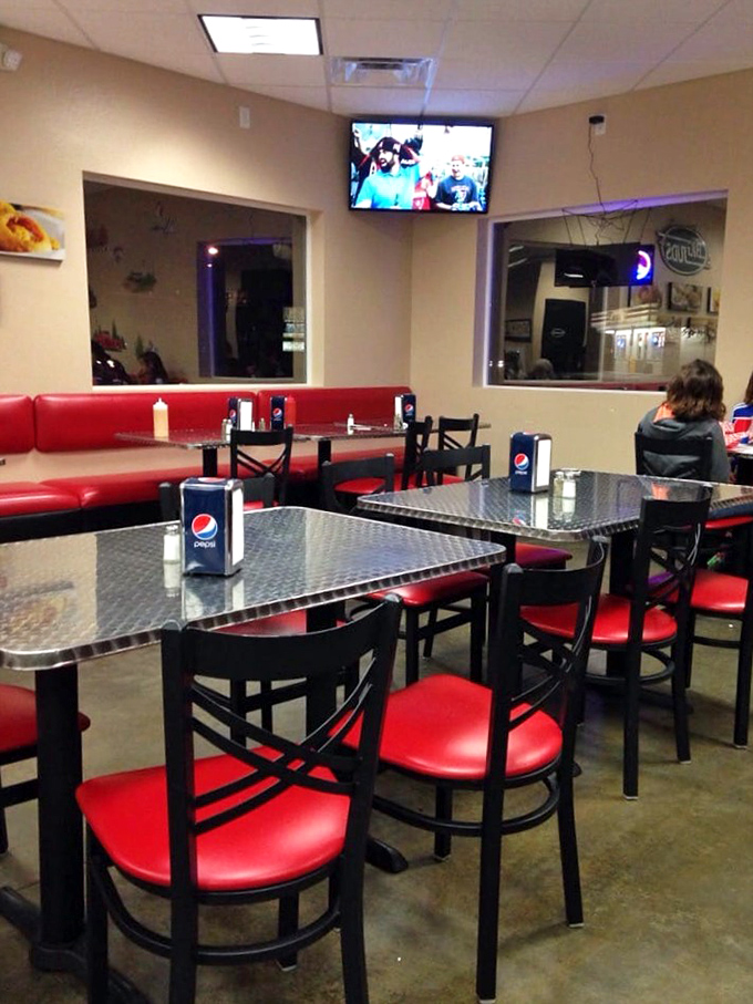 Classic diner vibes with red vinyl booths and metal-topped tables create the perfect backdrop for the impending food adventure.