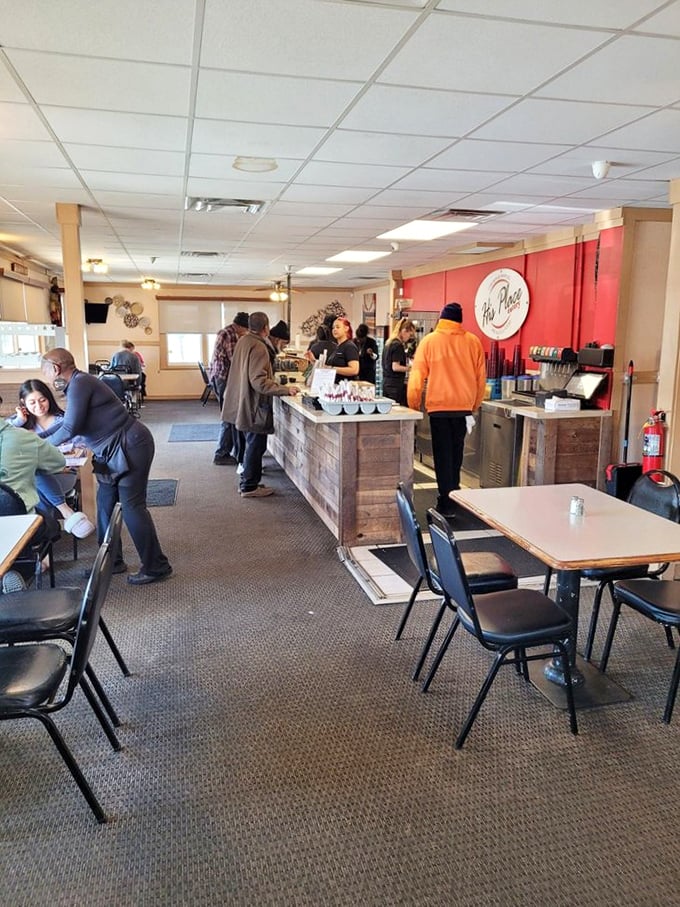 Where the magic happens. The rustic wooden counter welcomes hungry pilgrims seeking comfort food transcendence in this no-frills dining sanctuary.